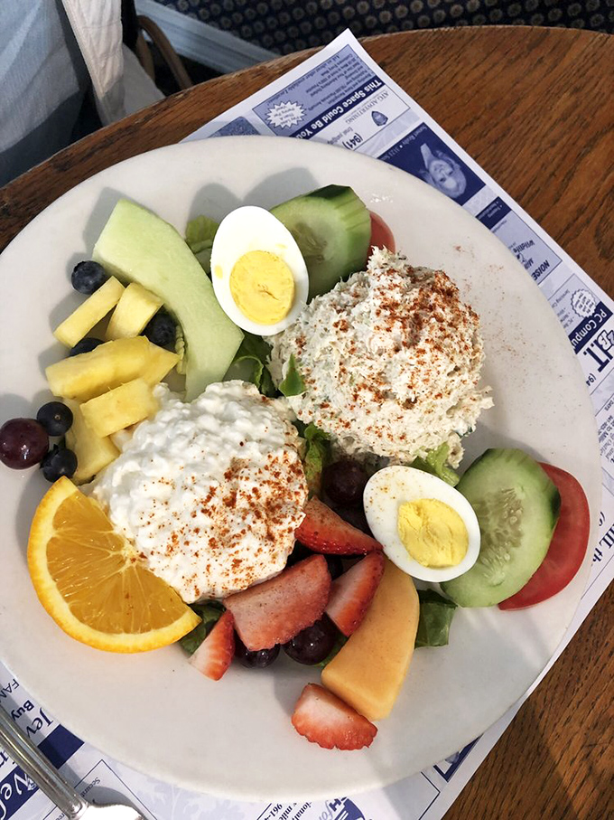A fruit and cottage cheese plate that somehow makes healthy eating look like a reward rather than a punishment—the breakfast equivalent of finding money in old pants.