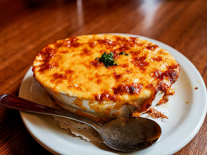 Mac and cheese elevated to art form—that golden, bubbling crust hiding creamy depths beneath. Comfort food that's had a serious upgrade.