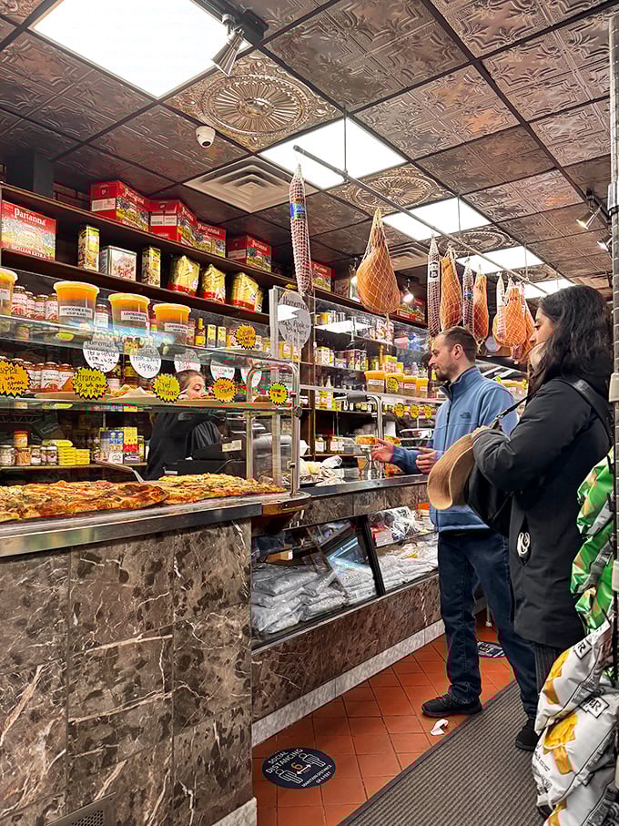 The deli case at Freddy's is like a museum where everything is edible—Italian meats, cheeses, and prepared foods beckon from behind glass.