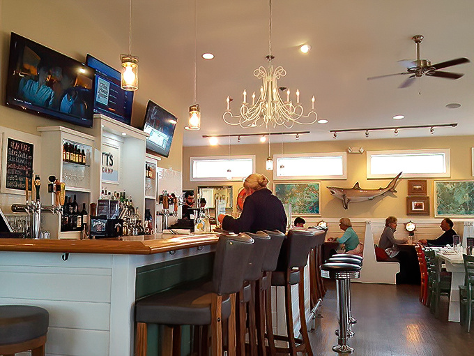A chandelier hanging over a seafood bar—because even casual coastal dining deserves a touch of unexpected elegance.