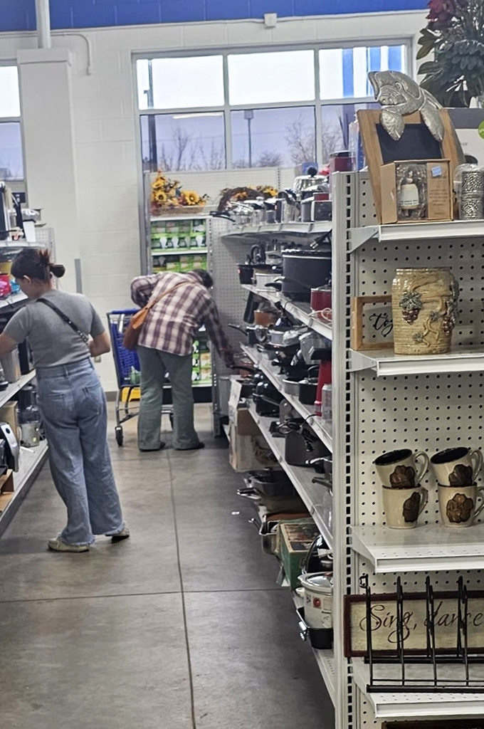 The kitchenware aisle: where shoppers hunt for that perfect pot while contemplating how many slow cookers one person really needs.
