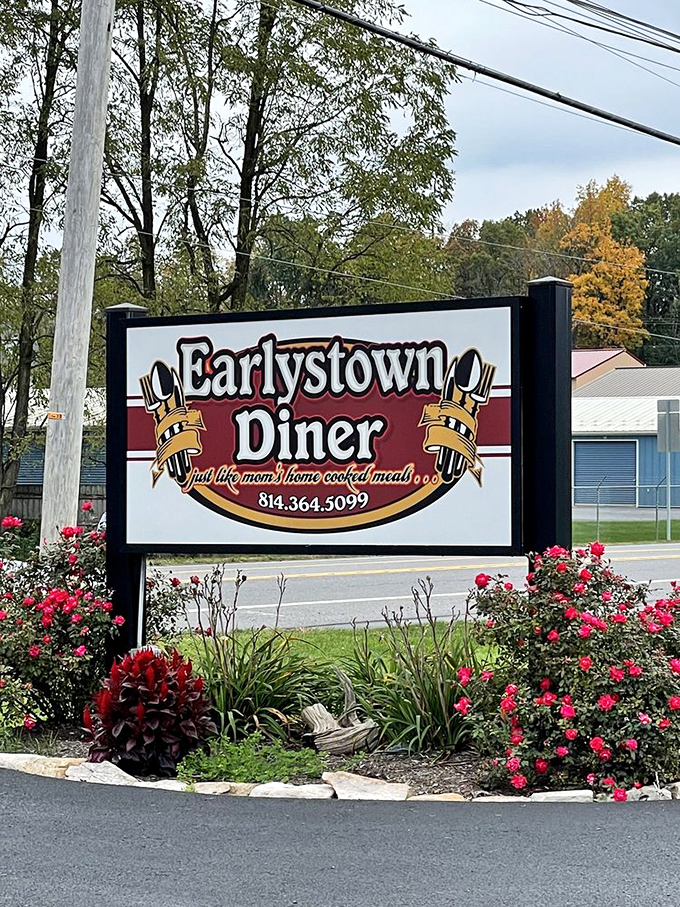 The sign promises "just like mom's home cooked meals," and unlike most roadside promises, this one's actually kept. Those roses aren't just landscaping—they're a welcome committee.