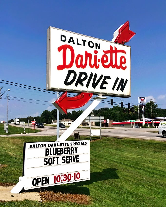 That iconic sign with its red arrows points the way to blueberry soft serve nirvana—like a neon lighthouse guiding hungry travelers home.