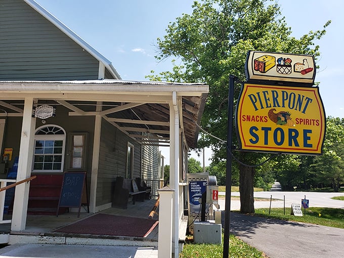 That vintage sign isn't trying to be retro-cool—it's just been doing its job for years, directing hungry travelers to salvation.