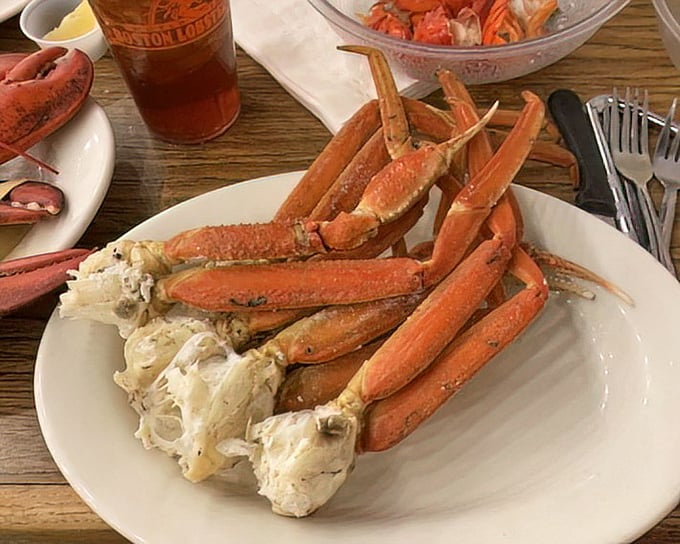 Snow crab legs arranged like nature's perfect eating utensils – delivering sweet meat that's worth every bit of cracking effort.