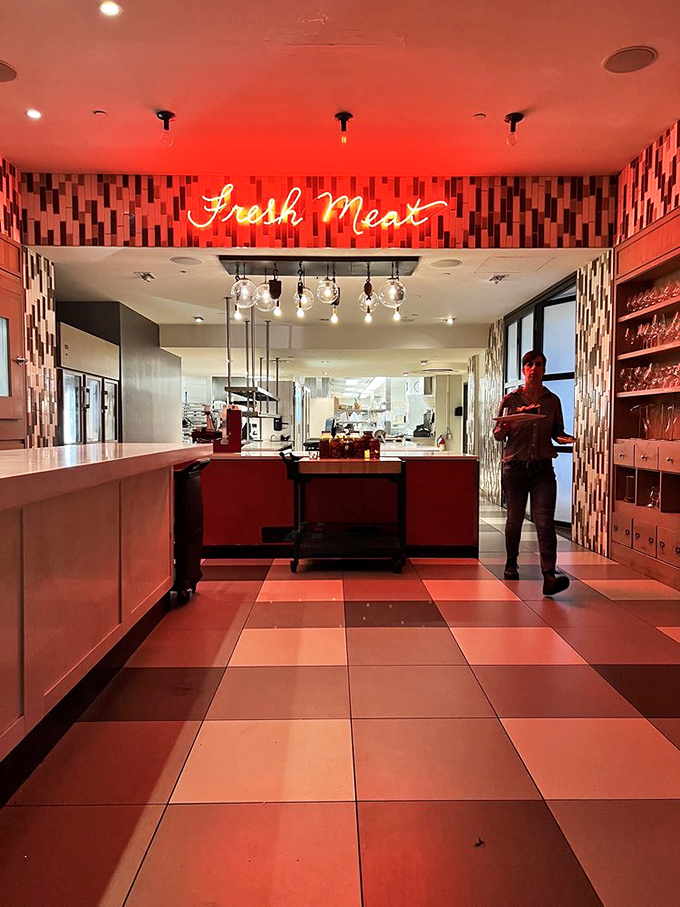 Under the neon glow of "Fresh Meat," the kitchen prepares carnivorous delights that would make even the most dedicated vegetarian pause for thought.