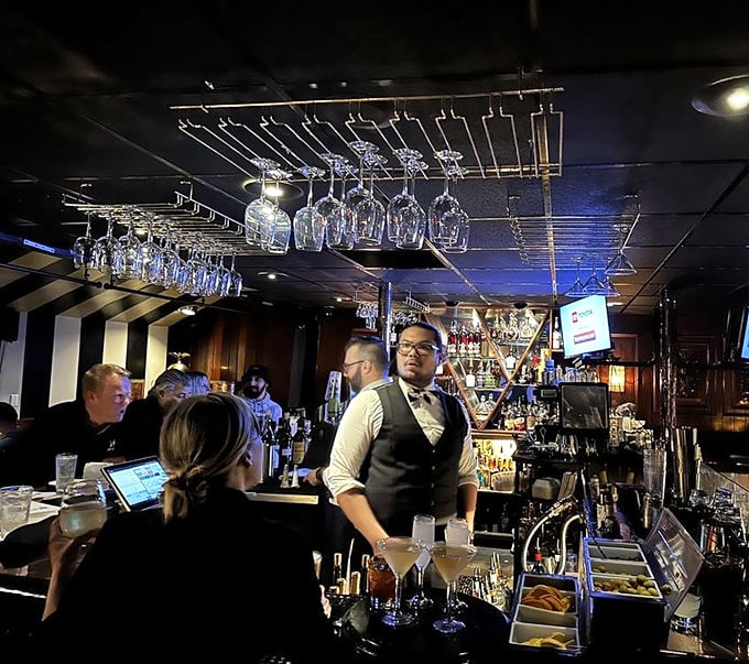 Behind the bar, mixology meets theater as skilled hands craft classic cocktails with the confidence that comes only from making thousands of perfect Manhattans.