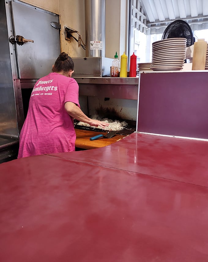 Where the magic happens. The time-honored tradition of smashing onions into the patty creates that distinctive Powers flavor profile.