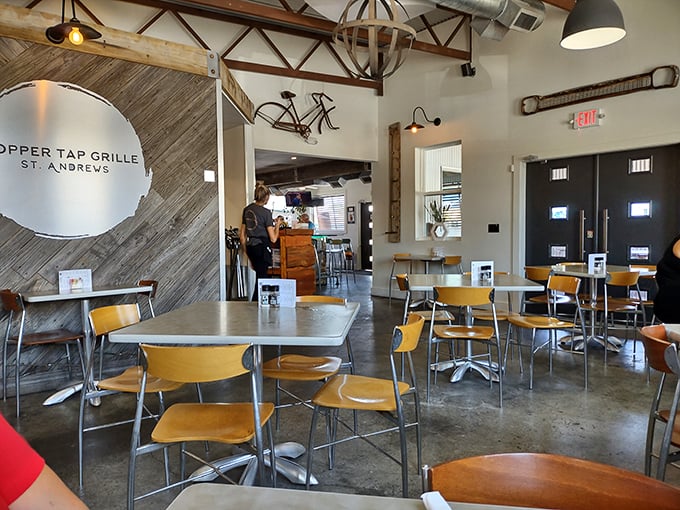A dining room where industrial elements like exposed beams and concrete floors somehow create warmth, not coldness—the perfect backdrop for seafood that steals the show.