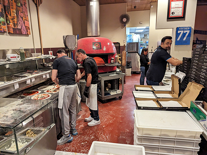 Behind every great pizza is a team of dedicated professionals. These aren't just cooks—they're guardians of tradition.