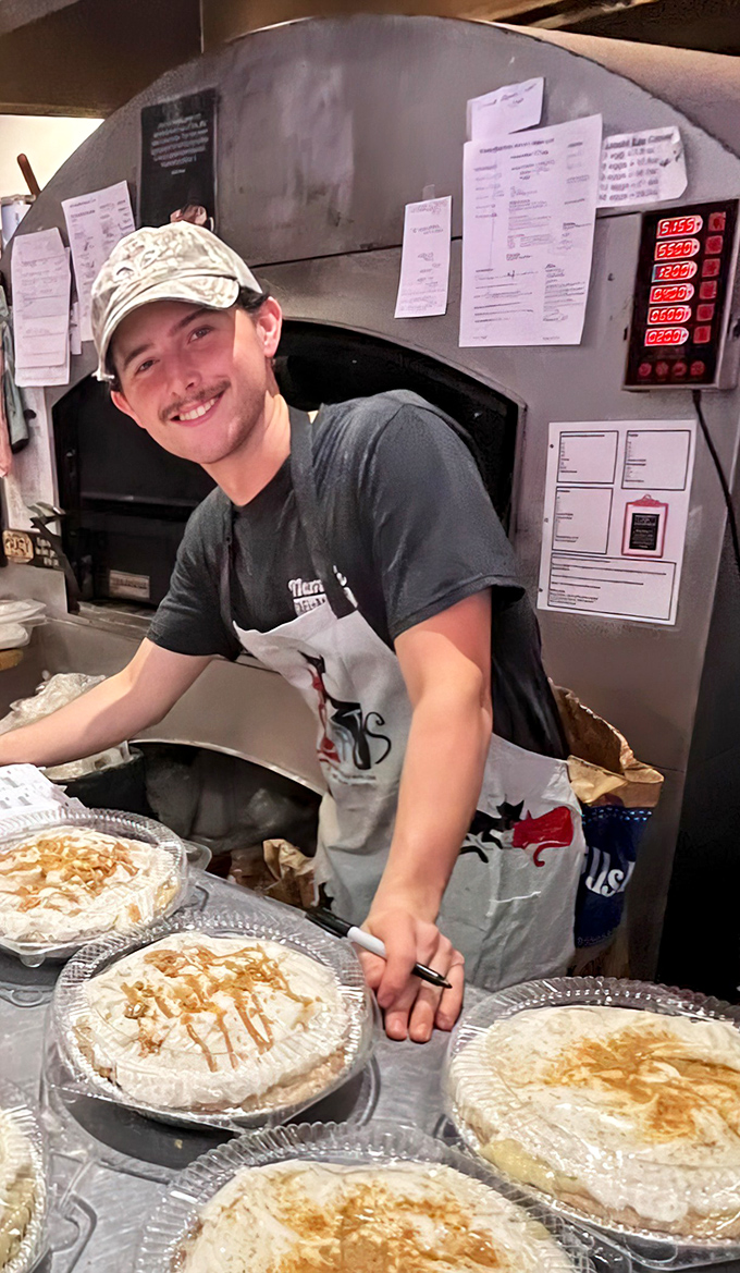 The smile says it all—baking isn't just a job, it's a calling. Those cream pies aren't just desserts, they're edible works of art.