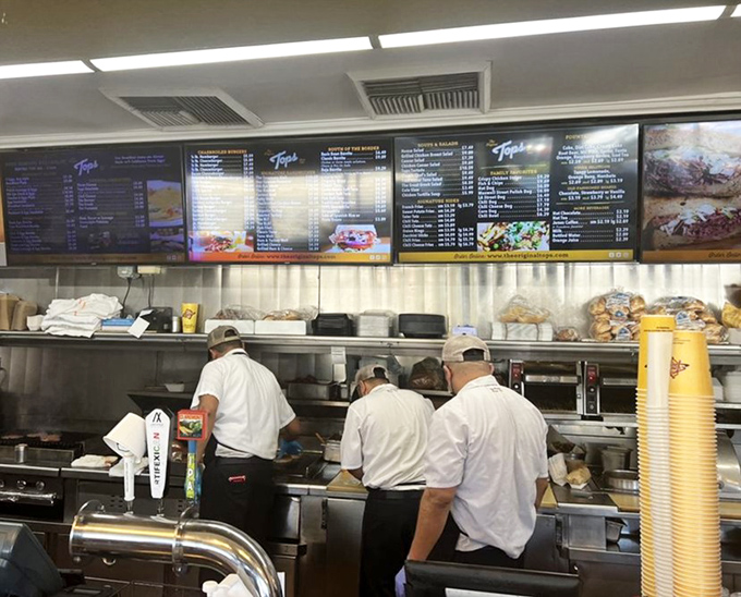 The white-shirted brigade, masters of their domain, turning simple ingredients into memories that last a lifetime.