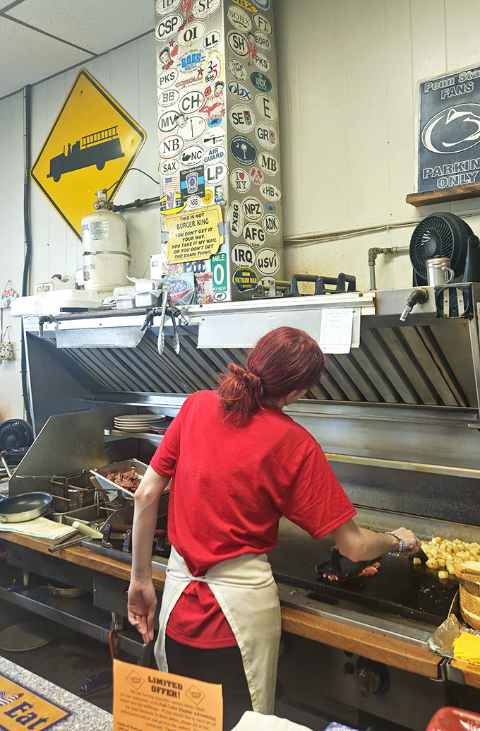 Behind every perfect breakfast is someone who's mastered the choreography of the flat-top grill – a culinary ballet performed daily without fanfare.