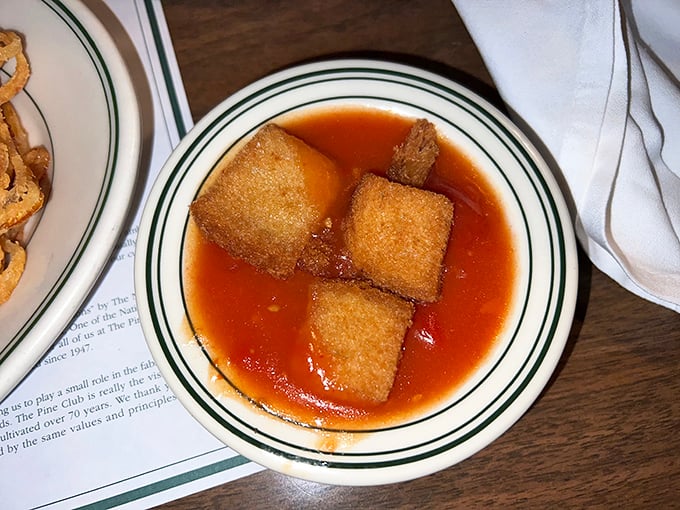 Stewed tomatoes—the Pine Club's signature side that converts even the most devoted vegetable skeptics. Sweet, tangy, and uniquely theirs.