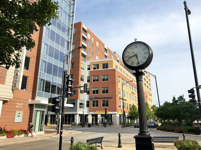 This clock doesn't just tell time – it anchors the neighborhood in a statement that says, "Yes, we're sophisticated, but we're never late for dinner."