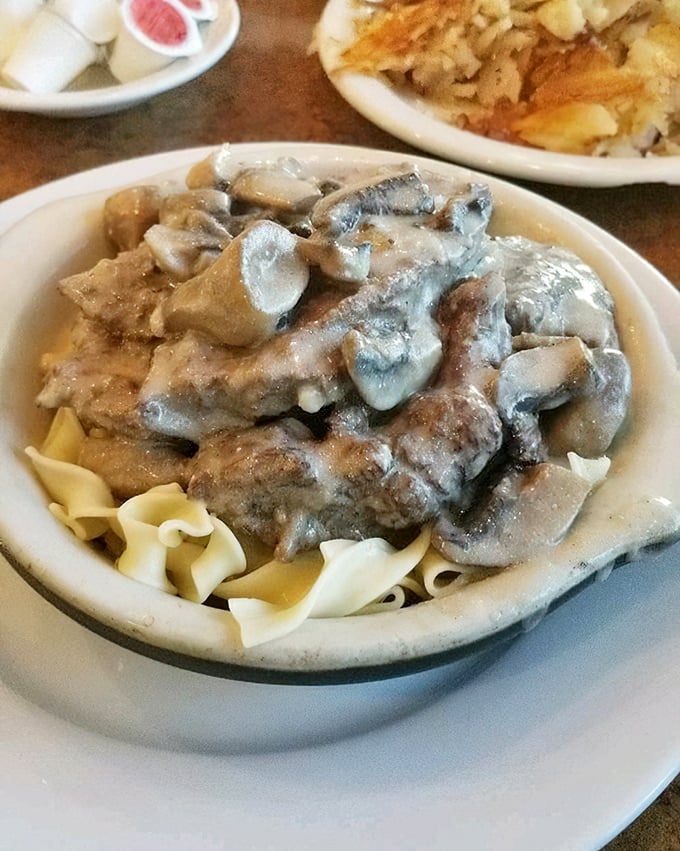 Beef Stroganoff over egg noodles—the kind of hearty, mushroom-laden comfort that makes you want to hug the chef and adopt them into your family.
