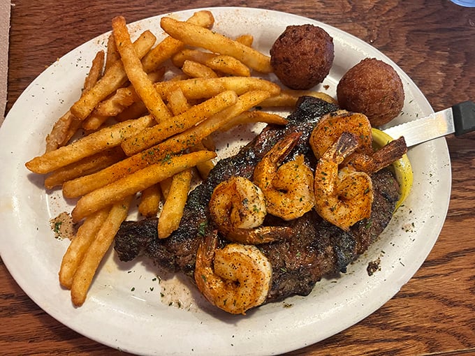 Surf and turf with a side of perfectly seasoned fries and hushpuppies—proof that sometimes more is exactly the right amount. 