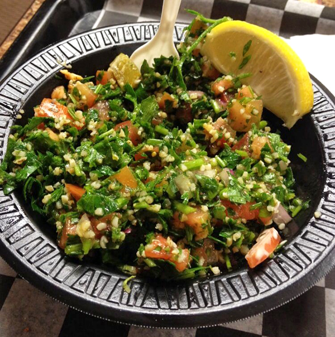 Tabbouleh that's parsley-forward as it should be—bright, lemony, and fresh enough to make you temporarily forget about meat.