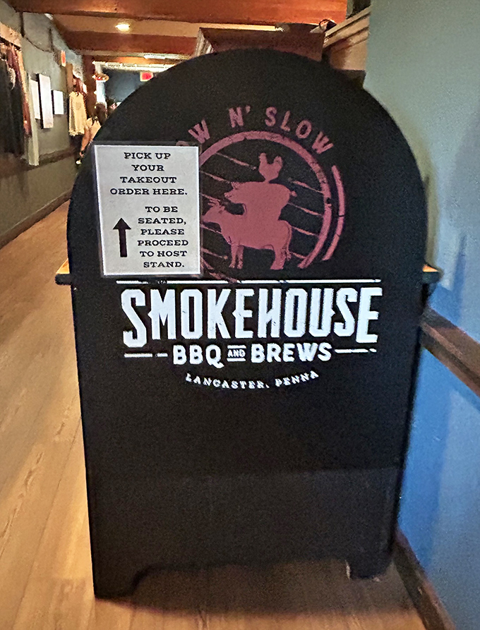 The "Low N' Slow" philosophy proudly displayed at the takeout stand – because good barbecue, like good relationships, can't be rushed.