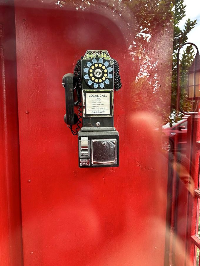 That vintage phone booth isn't just decoration—it's a time portal to when making dinner reservations required actual human conversation.