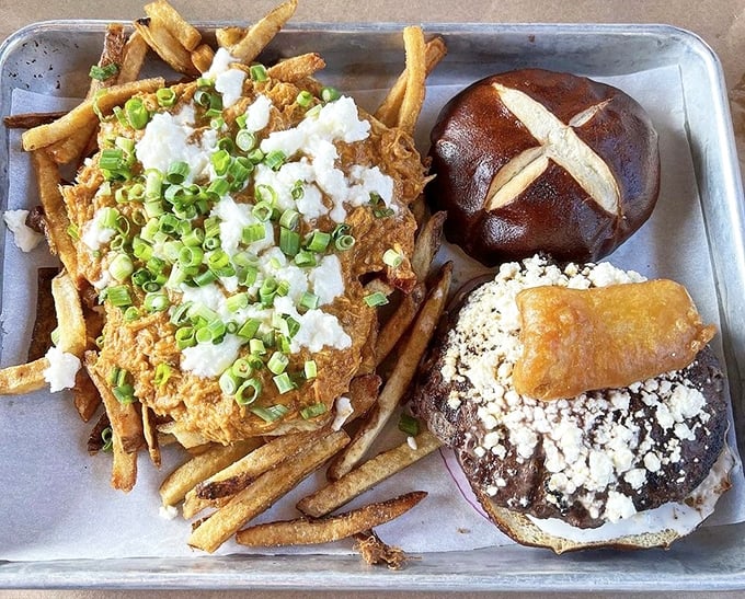 Fries that could make a Frenchman weep, paired with a burger that demands your respect. This tray doesn't just hold food—it cradles dreams.