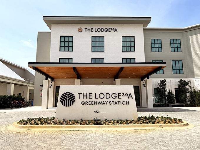 The Lodge 30A stands as a modern oasis amid coastal charm. Clean lines and palm trees—architecture's perfect vacation romance.