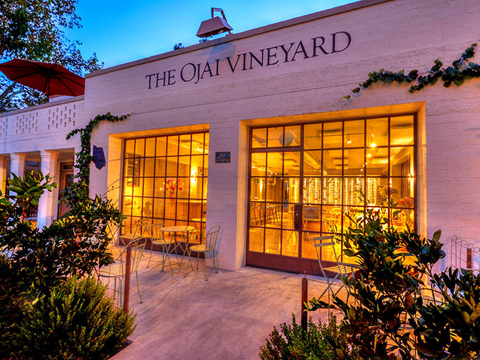 The Ojai Vineyard Tasting Room glows at dusk like a lantern of possibility – where retirement savings transform into memorable evenings.