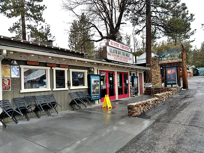 The Rustic Theatre – where Hollywood premieres may be miles away, but movie magic feels right at home. Those red doors promise entertainment mountain-style.
