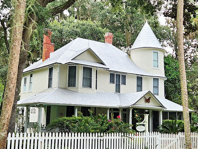 The Simonton House's Victorian charm and white picket fence belong on a postcard captioned "Wish you were here instead of at that crowded theme park."