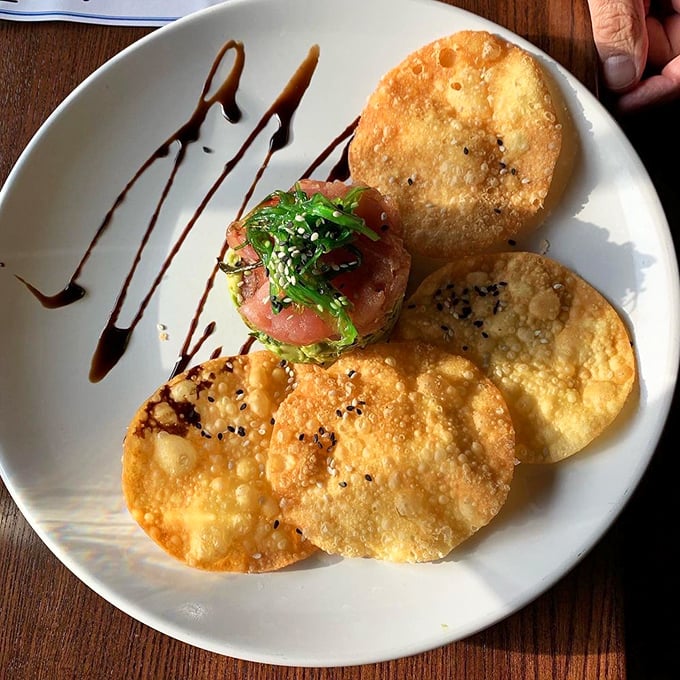 Tuna tartare surrounded by crispy wontons—proof that sometimes the best cooking happens when the chef decides not to cook at all.