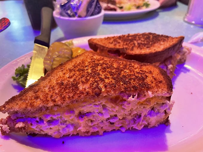Grilled to golden perfection, this sandwich reveals its treasure between toasted slices—a melty interior that stretches with each bite into comfort food nirvana.