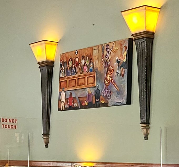 Wall sconces that cast a warm glow on whimsical artwork—proof that ambiance doesn't require a designer's budget, just thoughtful touches.