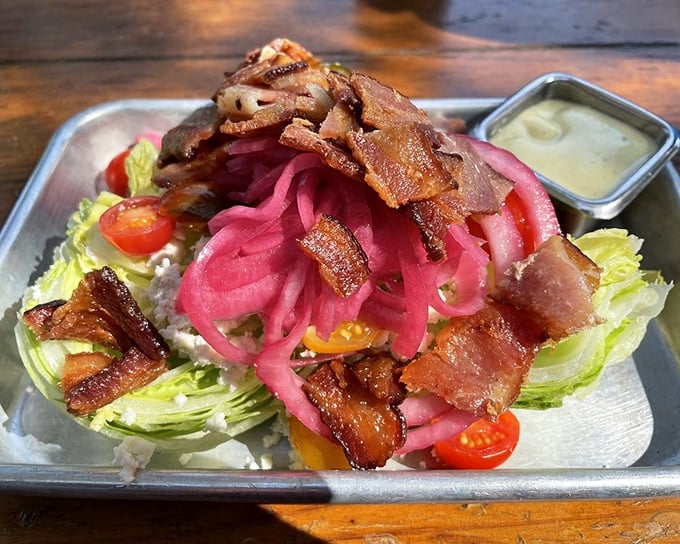 The wedge salad—reinvented with pickled onions and bacon that would make even your vegan friend consider a "cheat day."
