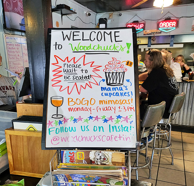 The handwritten welcome board with its BOGO cupcake offer feels like a personal invitation to indulge—complete with Instagram handle for the social media savvy.
