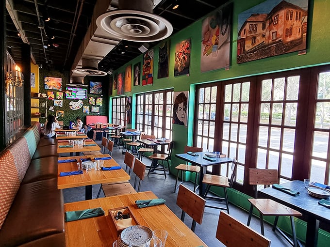 Sunlight streams through windows illuminating walls adorned with local artwork – dining here feels like eating inside a living gallery that happens to serve amazing food.