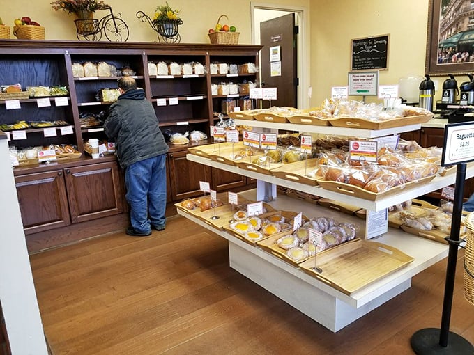 The bread display that launched a thousand carb cravings. Each loaf and roll sits patiently, knowing its destiny is to become someone's perfect moment.