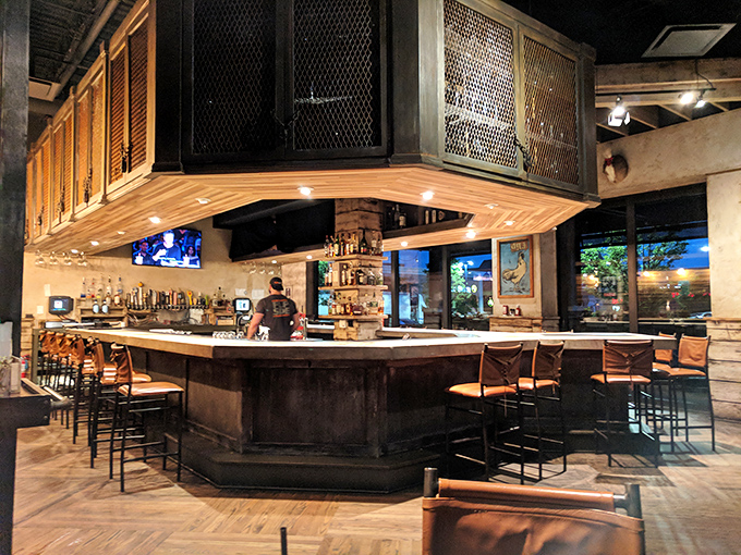 The bar area—where decisions are made, friendships are strengthened, and the bartenders know exactly what you need before you do.