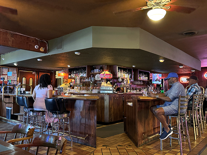 A bar that doesn't need to try too hard—just solid wood, cold drinks, and the promise that you can leave your pretensions at the door.