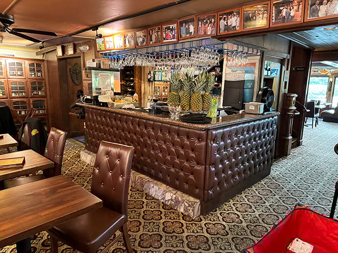 A bar area that says "we take our drinks as seriously as our seafood" – with hanging glassware that catches light like crystal chandeliers.
