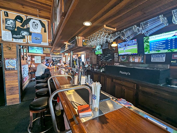 The bar at Rocky's—where regulars have worn grooves into their favorite spots and bartenders remember your usual order without asking.