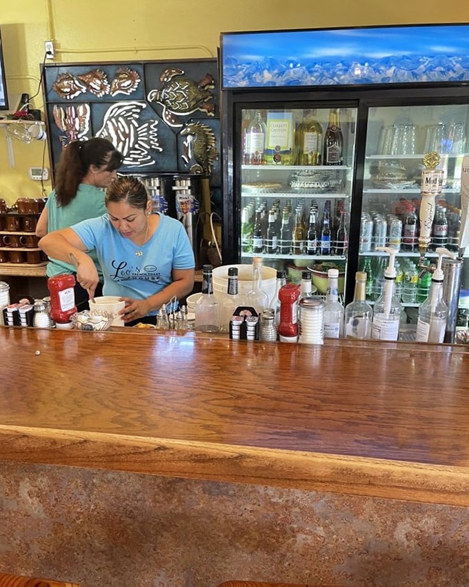 Behind every great restaurant is a bar where magic happens—this one adorned with sea life art that reminds you you're in Florida.