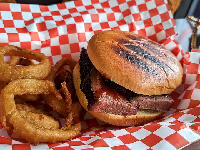 A brisket sandwich that makes all other sandwiches seem like mere practice runs. Those onion rings aren't just sides—they're golden halos of deliciousness.