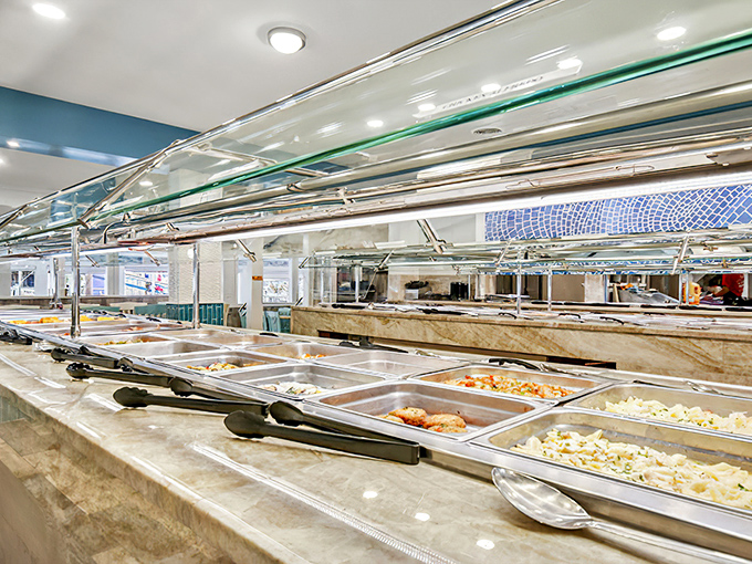 The buffet line—where dreams and dinner plates are filled in equal measure. Each tray holds a new adventure for your taste buds.