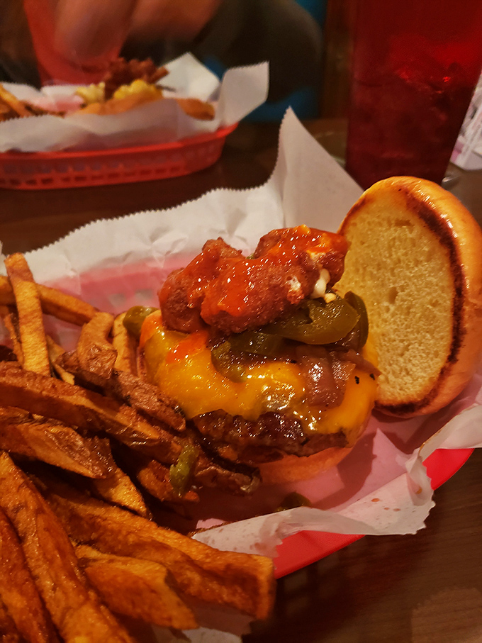 Cheese curds and special sauce crown this burger masterpiece – proof that sometimes more is exactly the right amount.