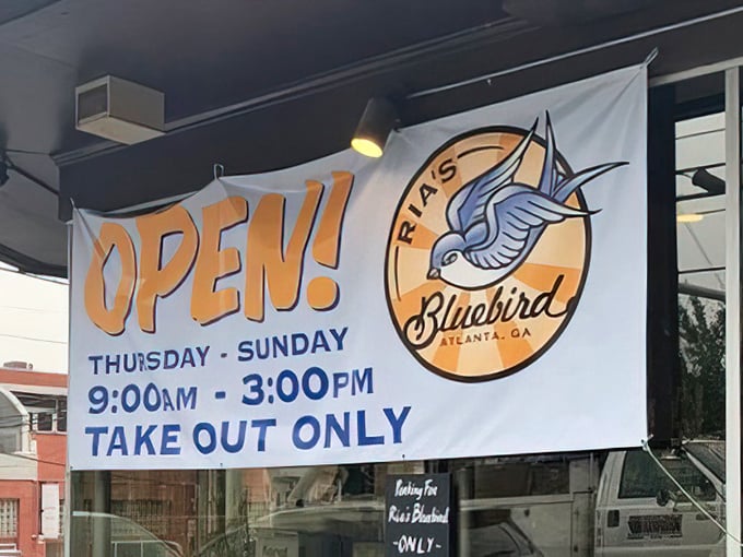 Even their "OPEN" banner features that iconic bluebird. When you've got food this good, you don't need fancy marketing—just clear directions.