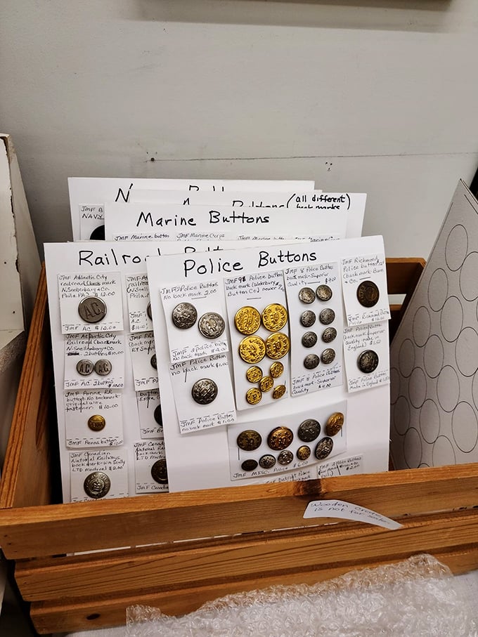 Not just buttons but tiny metal time capsules—each one once part of a uniform that witnessed history in the making.