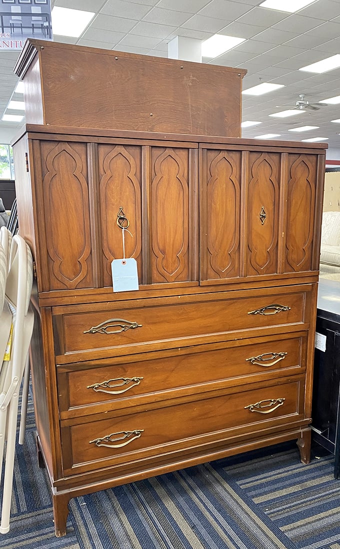 This isn't just a dresser—it's a piece of American furniture history waiting for its second act. Those ornate details whisper tales of dinner parties past.