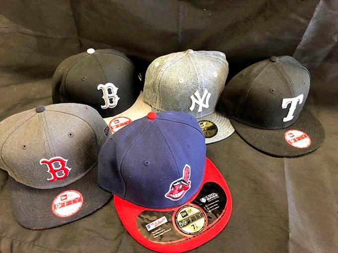 Baseball cap heaven for sports fans—representing team loyalties that might start friendly arguments in any Texas sports bar.