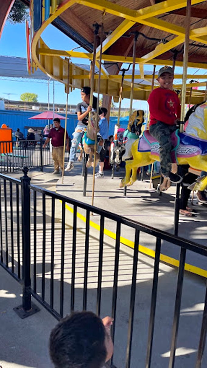 Round and round we go! This colorful carousel offers a moment of childhood joy for riders of all ages—nostalgia included at no extra charge.