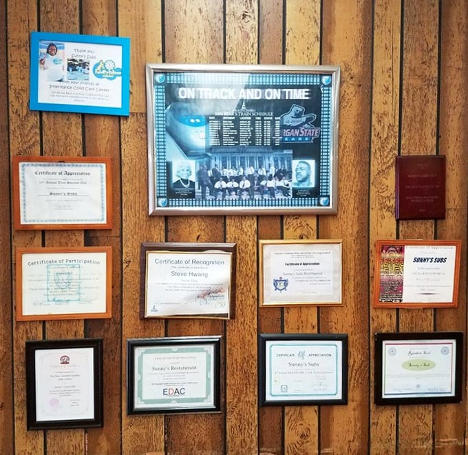 A wall of certificates and community recognition—the true measure of a beloved local eatery. These aren't Michelin stars, but they mean more.